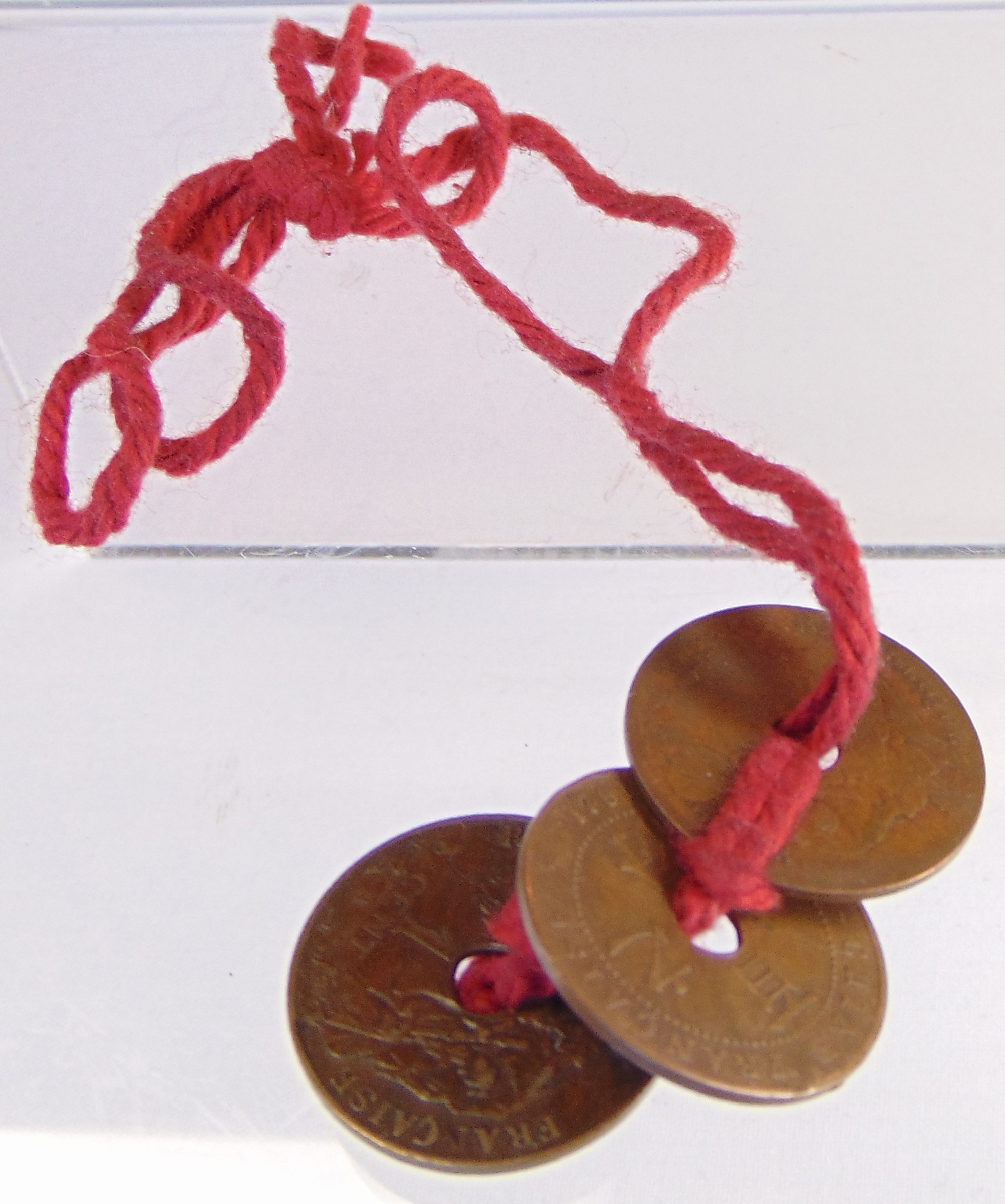 Silver Coins on Red String