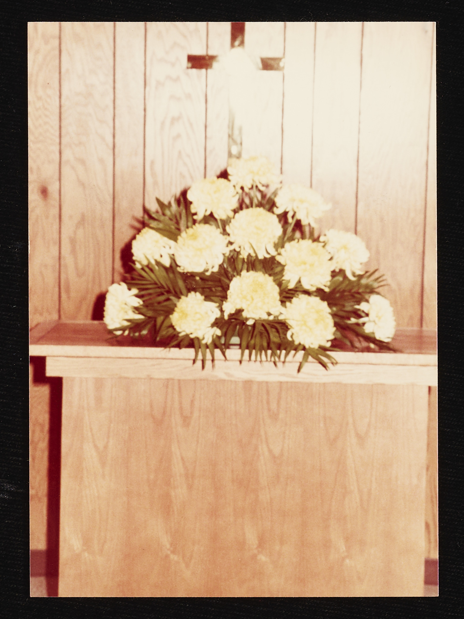 Flower Arrangement Underneath a Cross